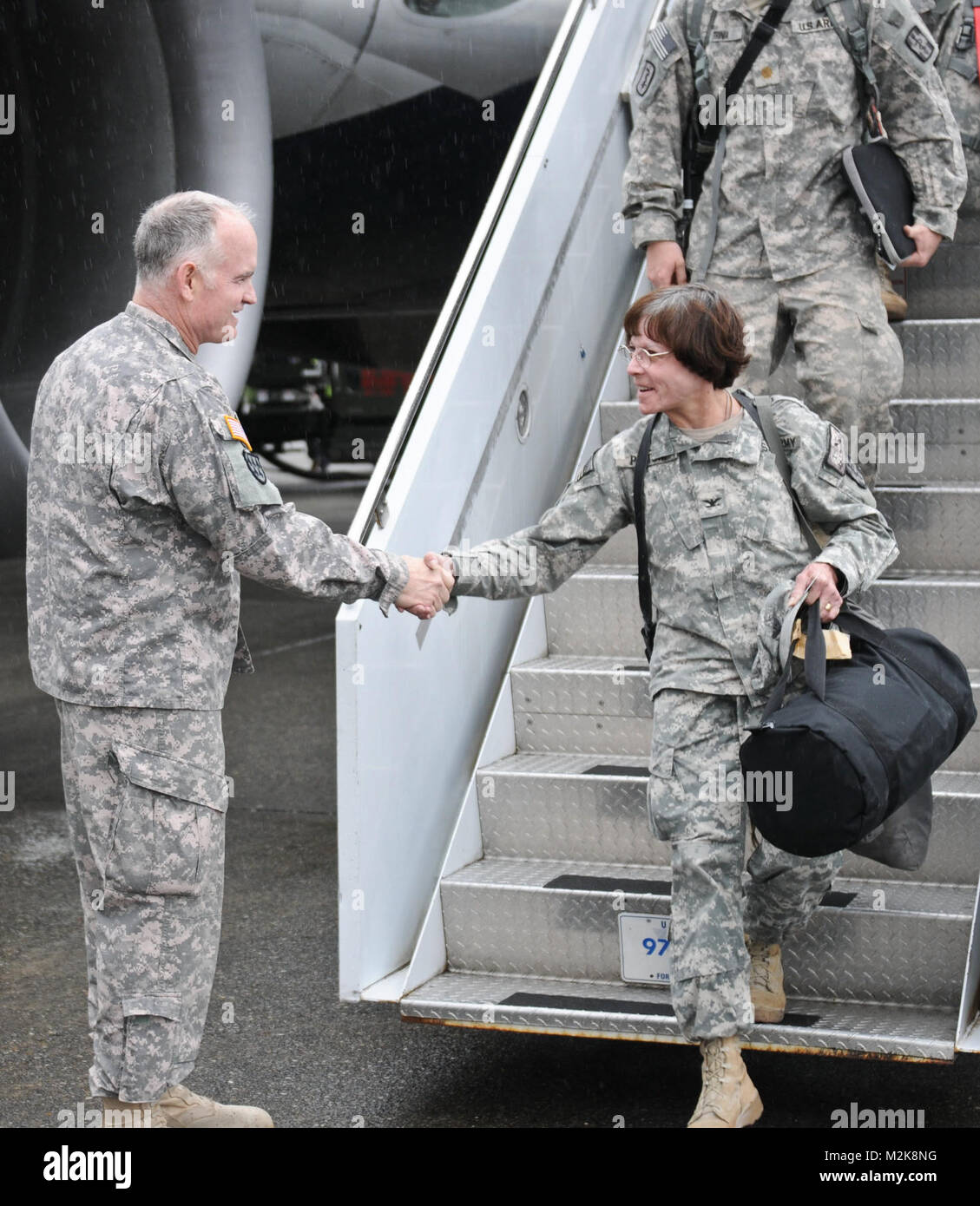 Maj. Gen. Charles A. Anderson greets Col. Kathy Platoni from the 467th ...