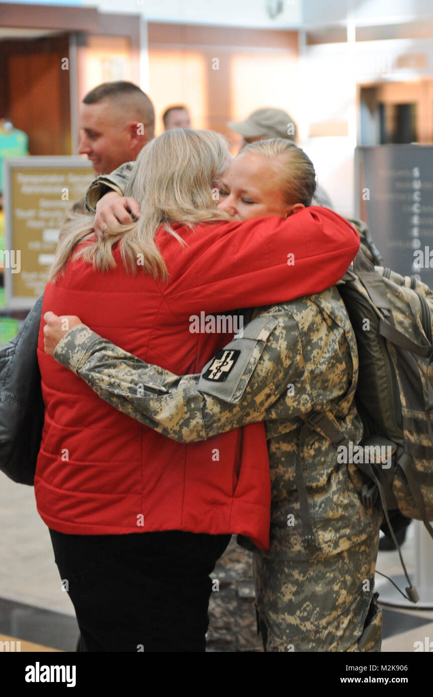 1st Lt. Amanda Beers hugs her mother Deborah upon her return from a ...