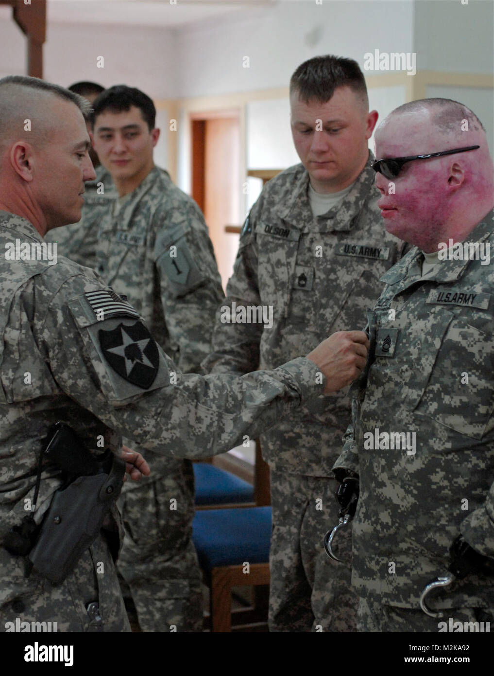 Giving a coin by 1st Armored Division and Fort Bliss Stock Photo - Alamy