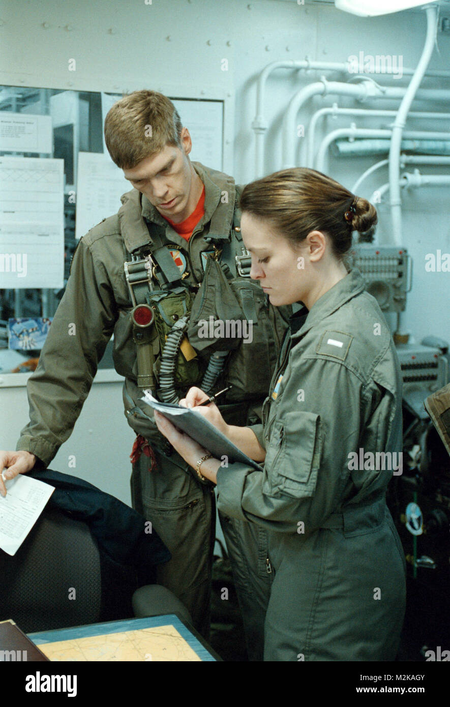 Pilots debrief Intelligence Officers upon returning to the USS ...
