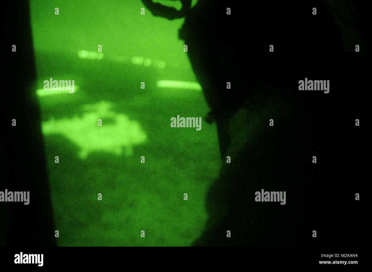 A Croatian Air Force crew chief member looks out the door and observe a ...