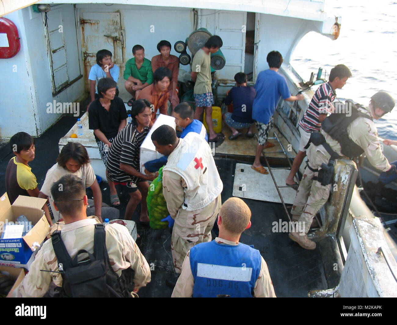 Members of a U.S. Navy rescue and assistance team provide humanitarian ...