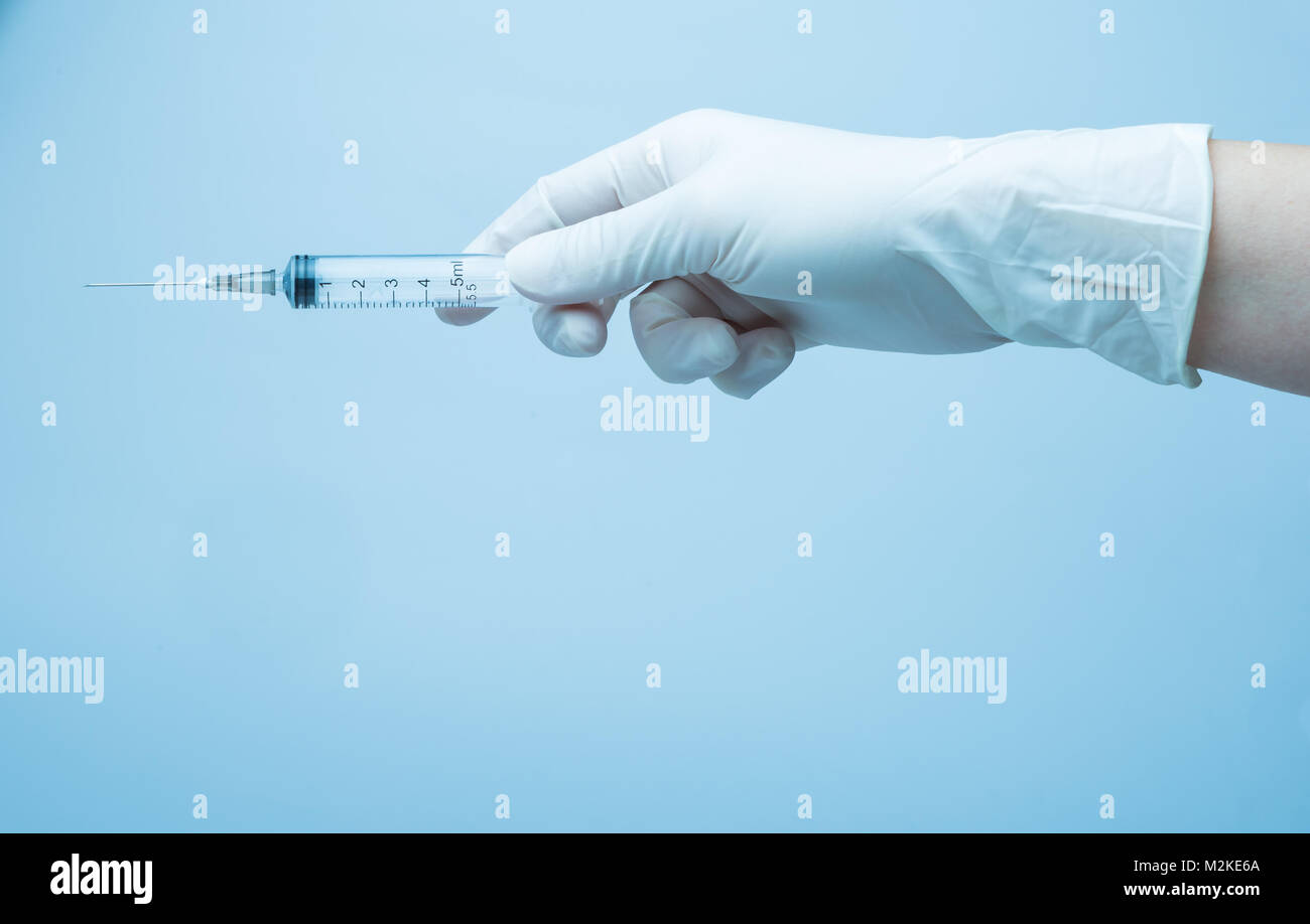 Syringe, medical injection and pills in hand, palm or fingers. Medicine ...