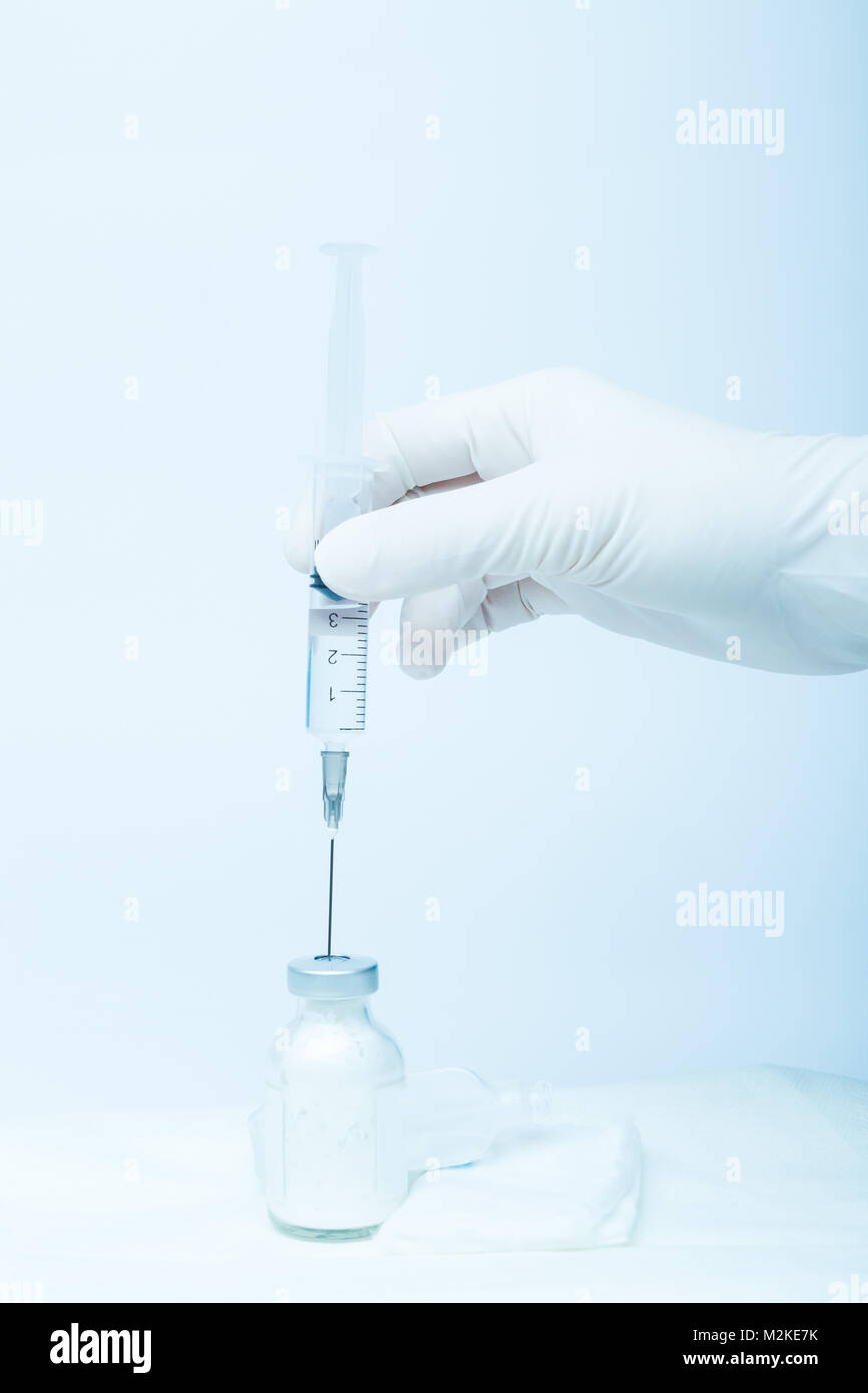 Syringe, medical injection and pills in hand, palm or fingers. Medicine ...