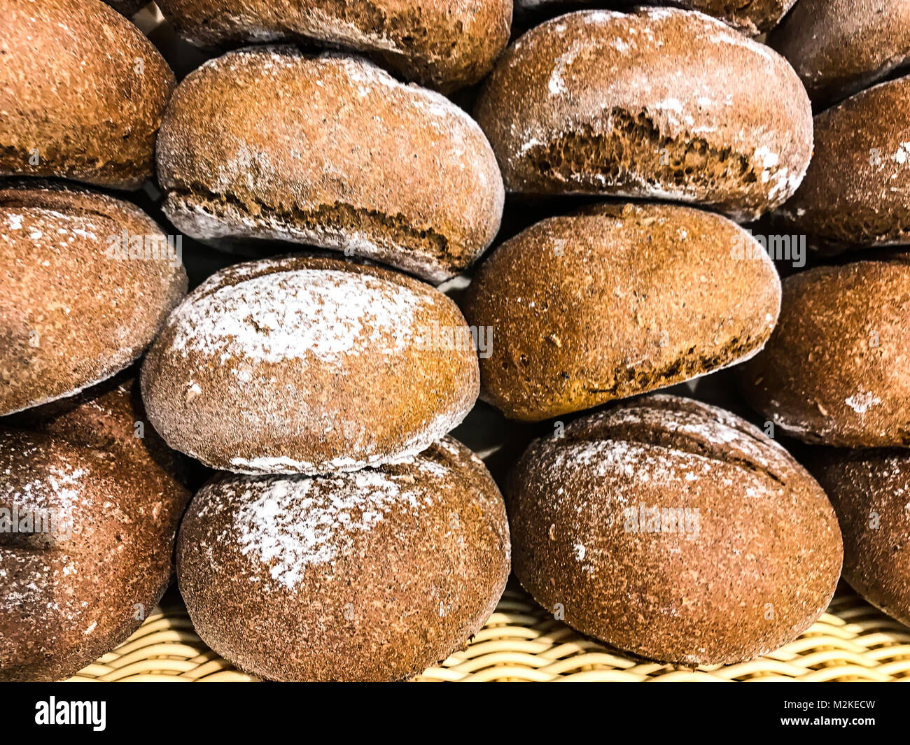 Whole-wheat rye rolls in bread basket Stock Photo - Alamy