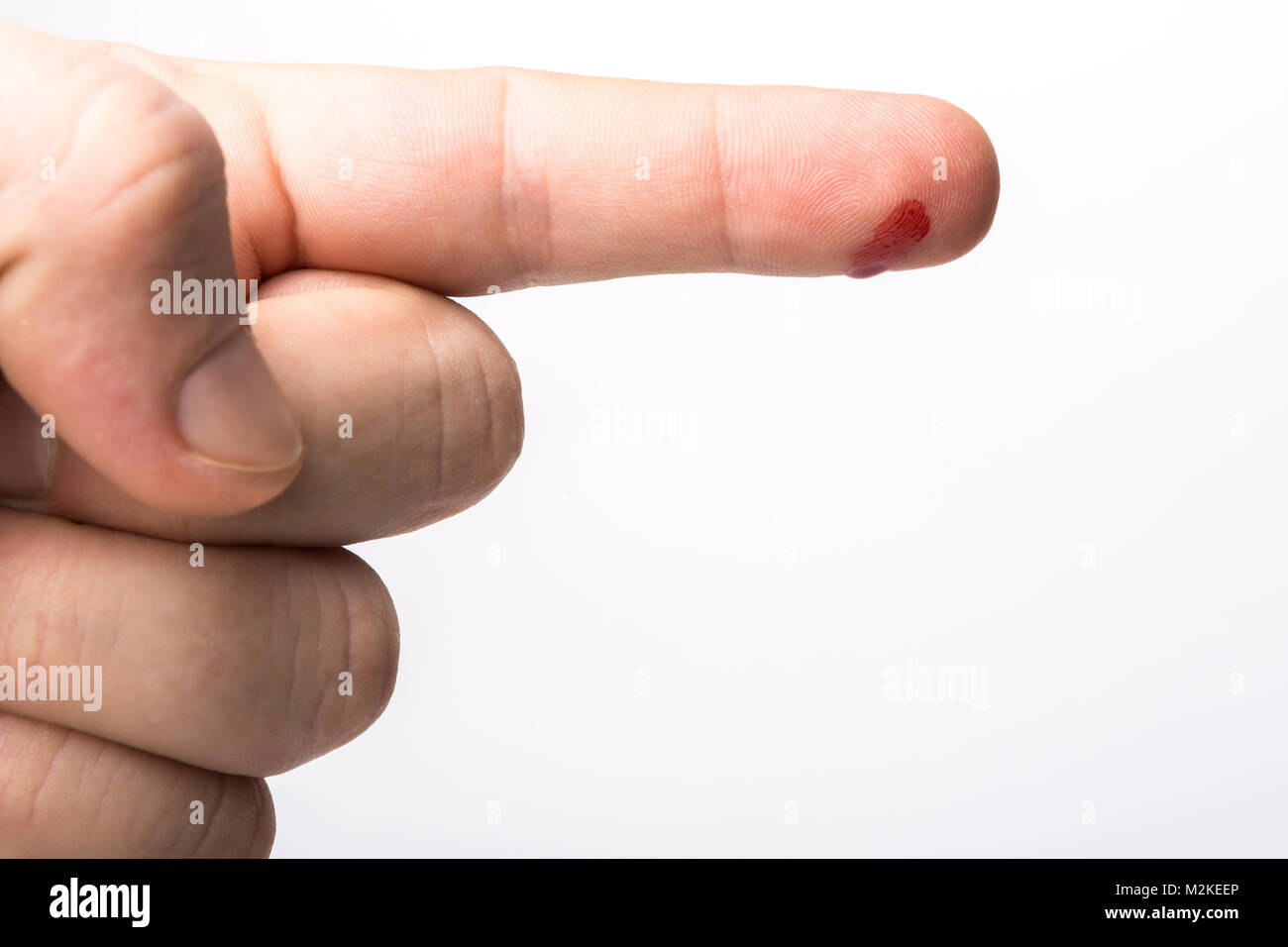 Finger with drop of fresh blood Stock Photo - Alamy