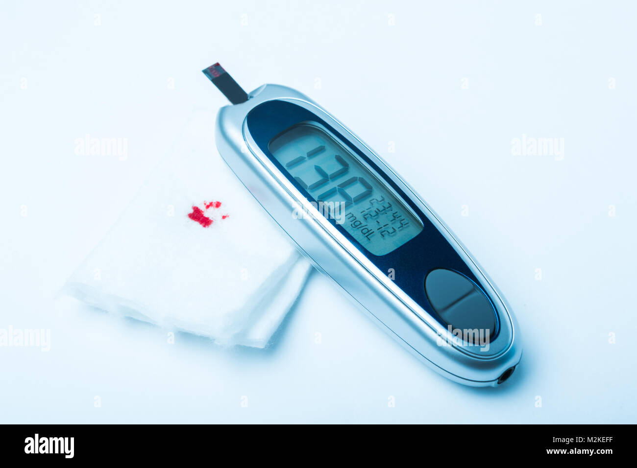 Diabetes patient measuring glucose level blood test using ultra mini ...