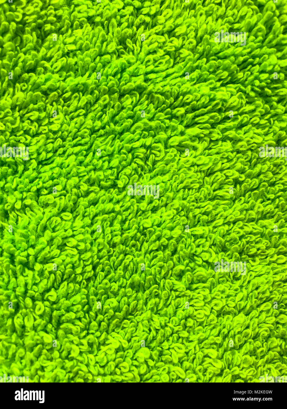 Abstract background of green terry cloth close-up Stock Photo - Alamy