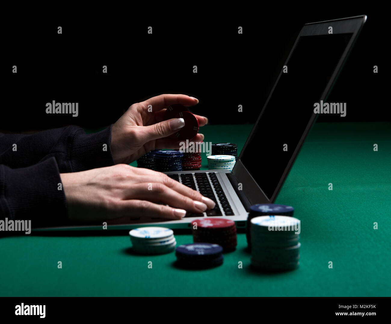 Playing poker on his laptop hi-res stock photography and images - Alamy