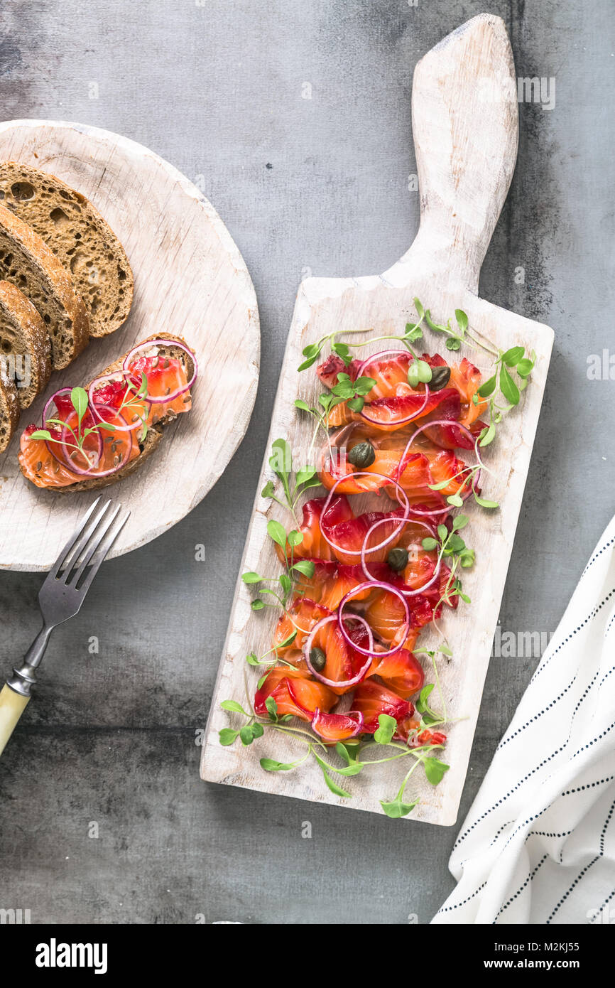Gravlax - scandinavian cured salmon or trout with onion and bread Stock ...