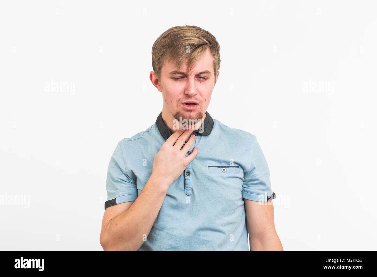 Sore throat. Men touching the neck. Sick guy isolated Stock Photo - Alamy