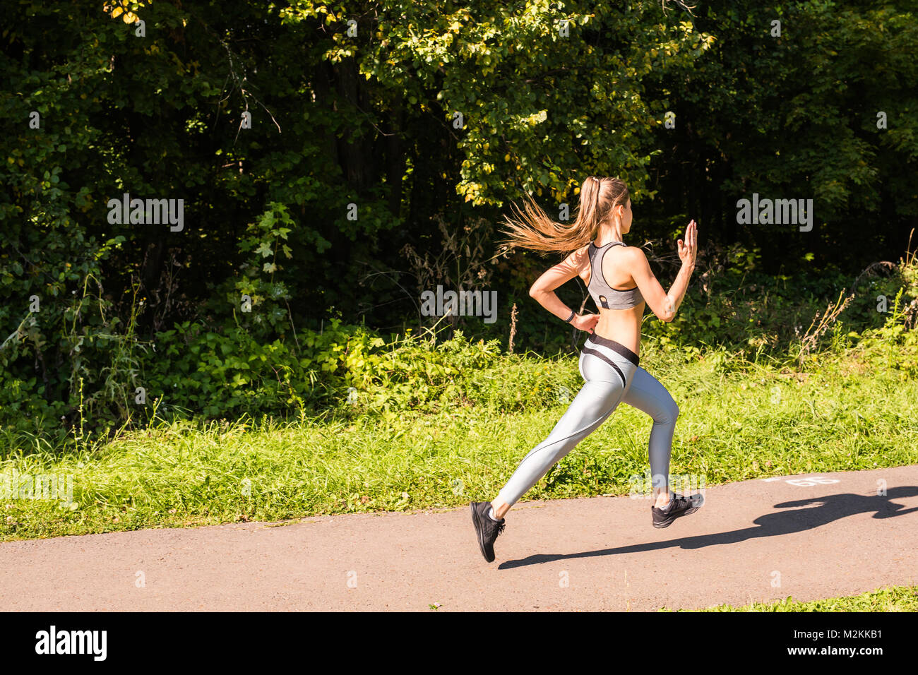 healthy lifestyle young fitness woman running outdoors Stock Photo - Alamy