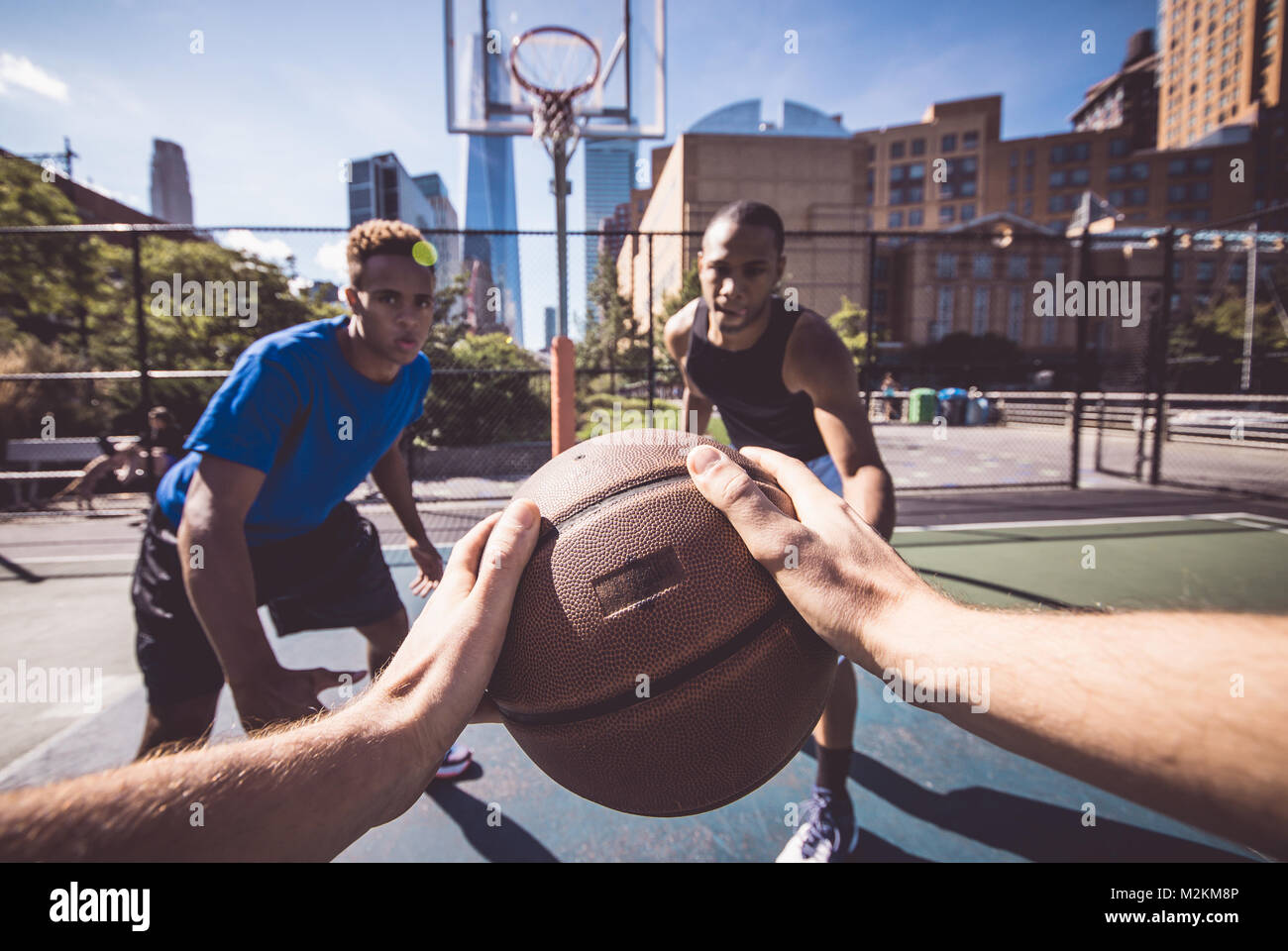 Two street basketball players playing hard on the court Stock Photo - Alamy