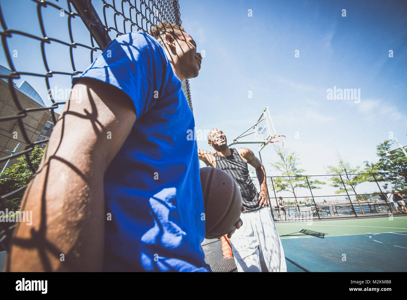 Two basketball players hanging around and having fun Stock Photo - Alamy