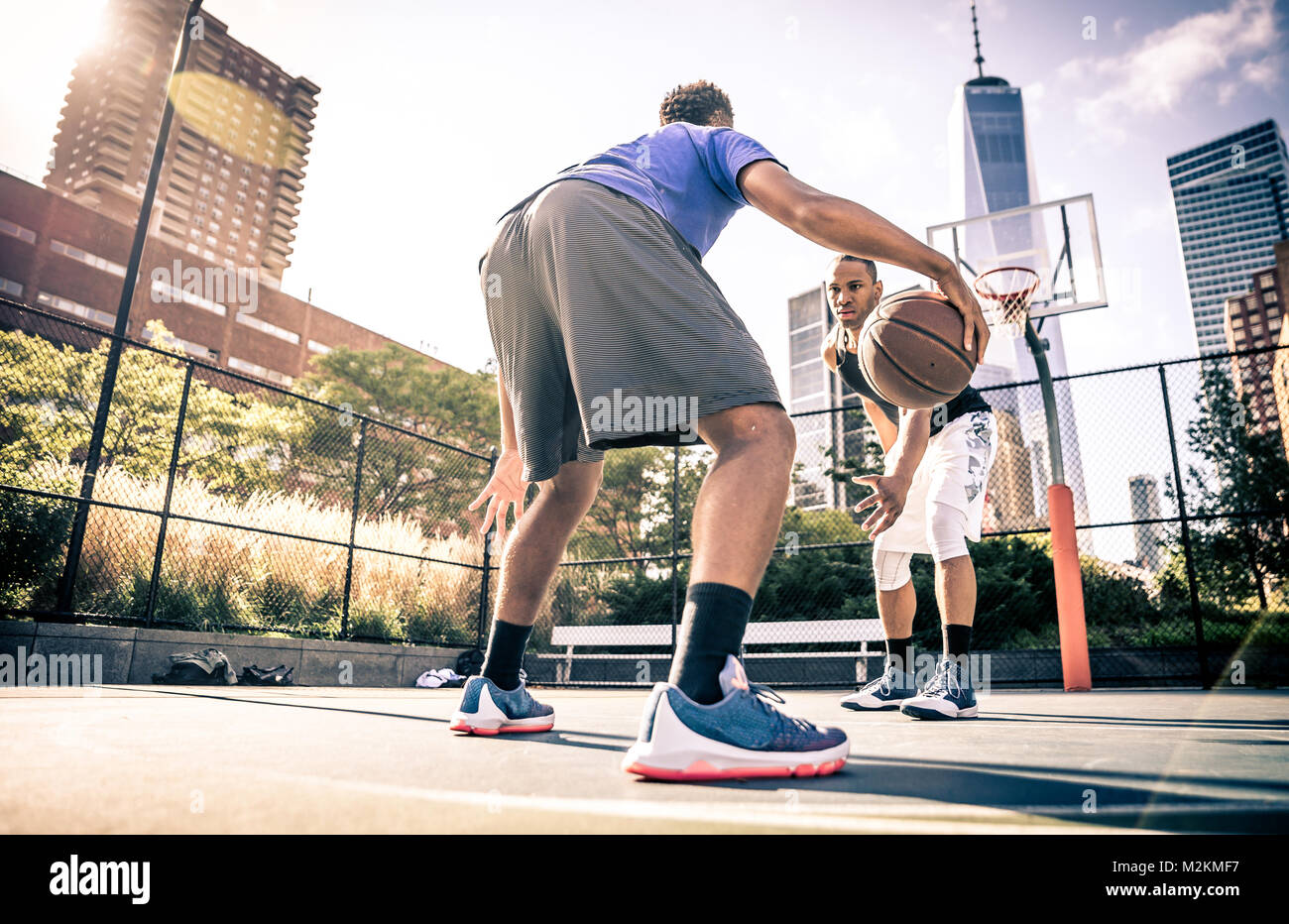 Two young men playing basketball outdoor court hi-res stock photography ...