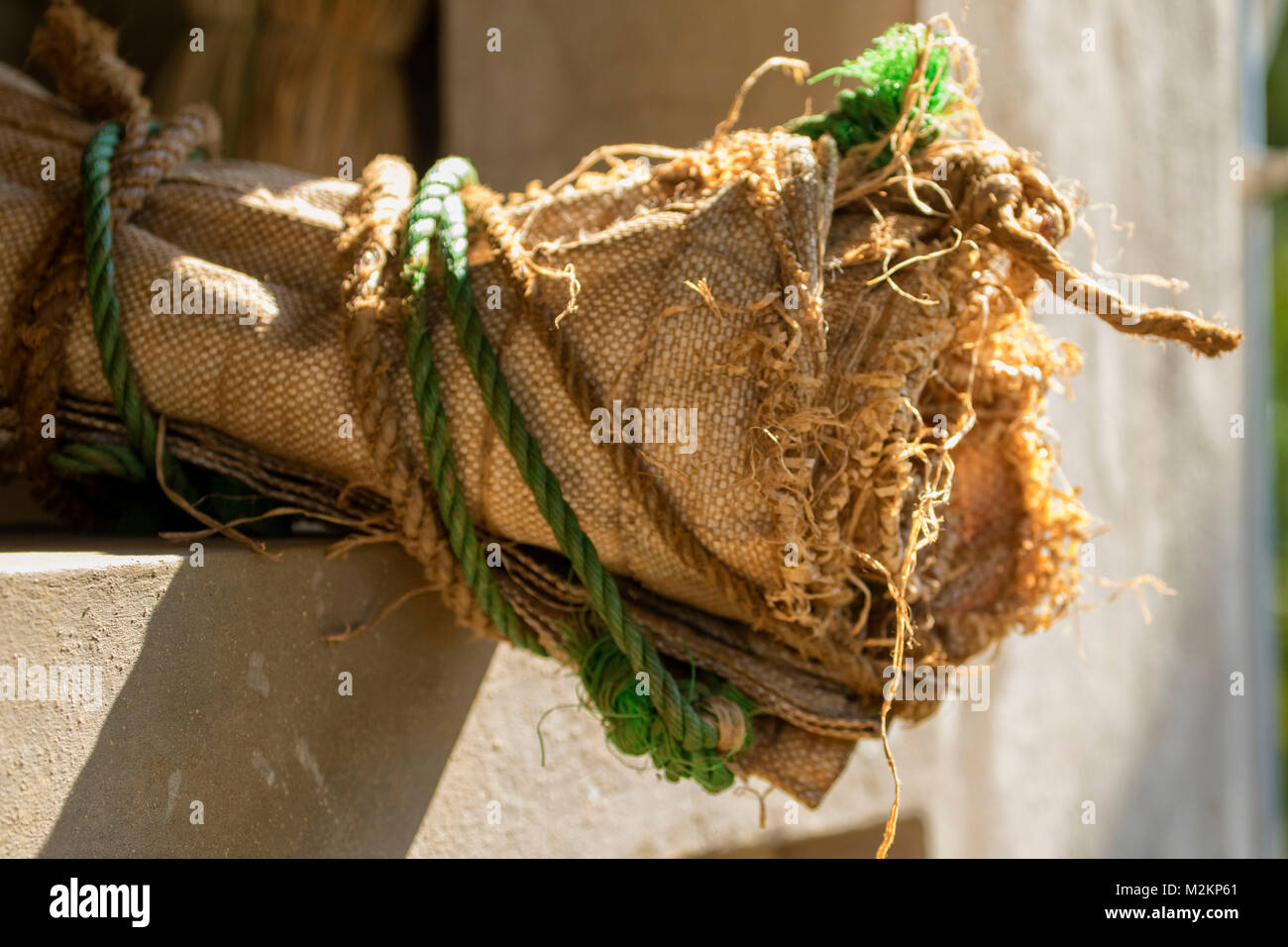 Abstract still-life photograph of rope on a cattle smallholding in ...