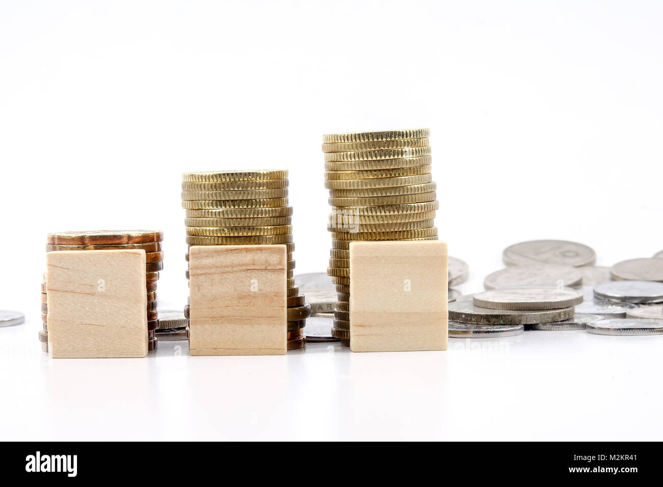 BUSINESS CONCEPT: Coins and wooden plate Stock Photo - Alamy