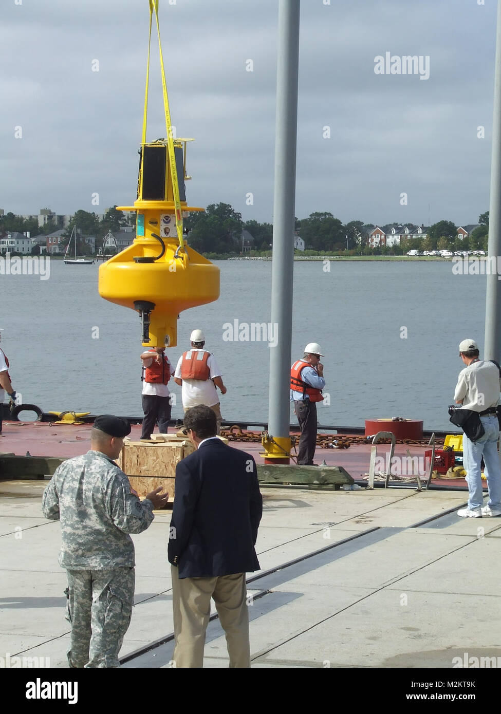 The crew of the Derrick Vessel Elizabeth uses its vessel crane to lift ...