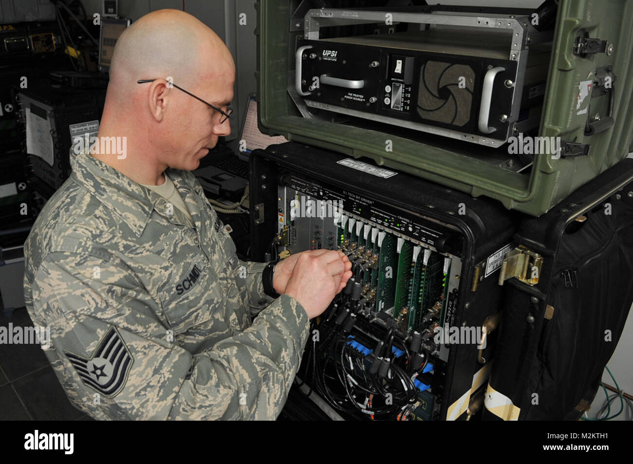 Airman adjusts basic access module used to manage defense system ...