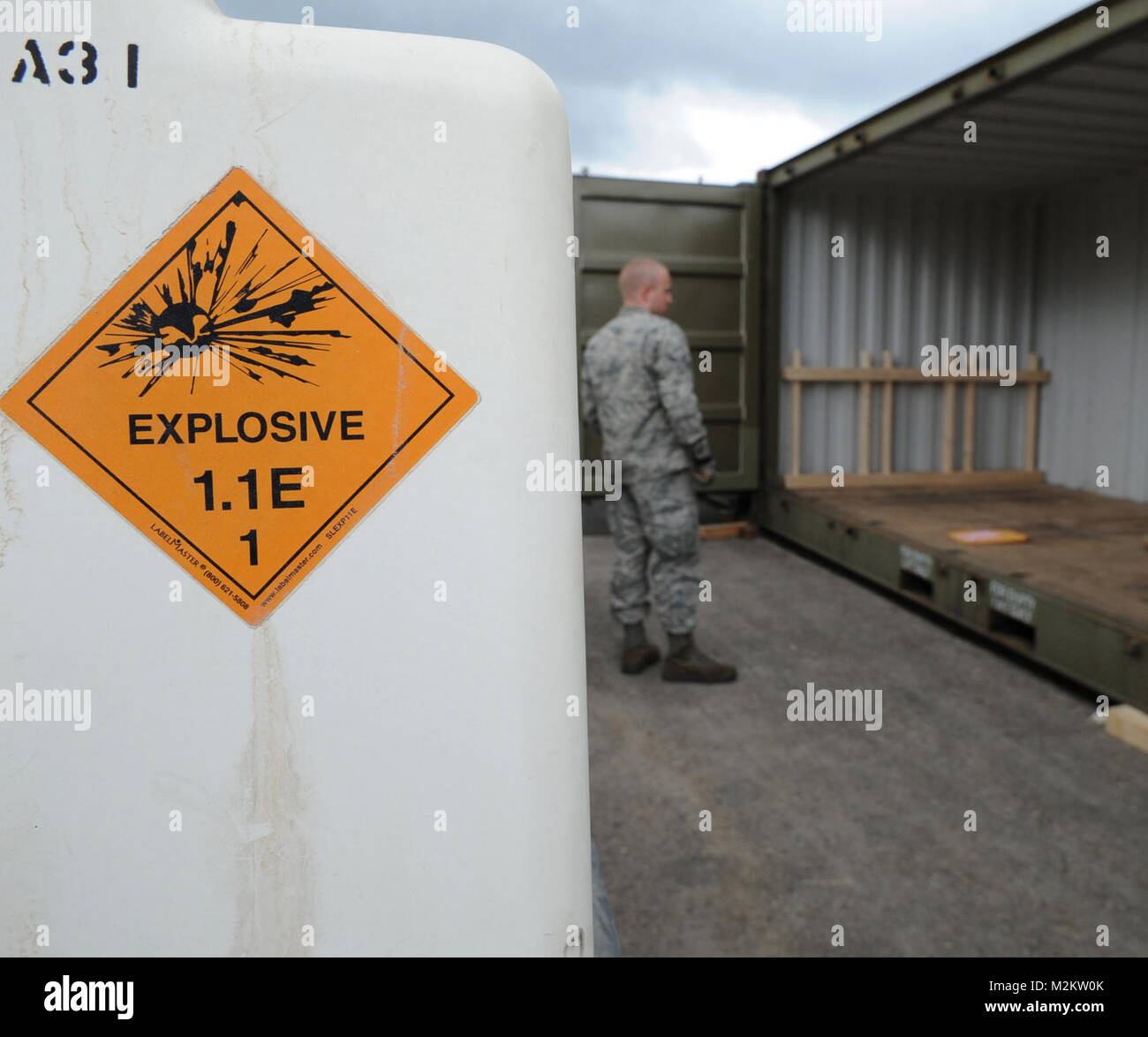 Members of the 86th Munitions Squadron load cargo trailers with ...