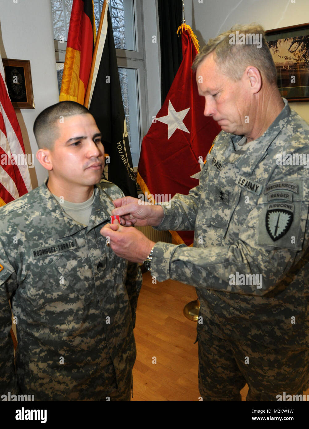 Sgt. Javier Rodriguez-Torres, left, a food service specialist assigned ...