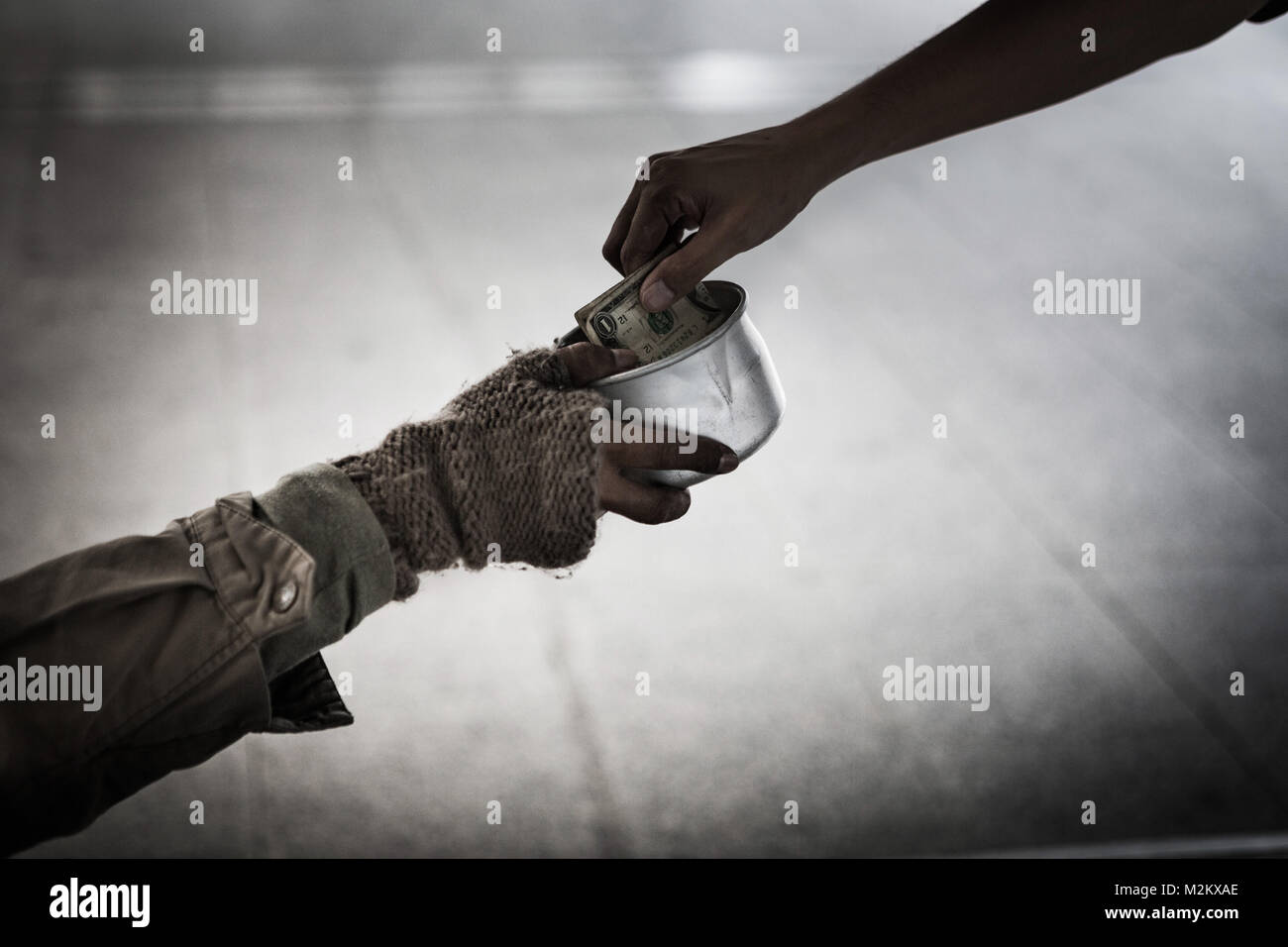 A hand give money to homeless people Stock Photo - Alamy