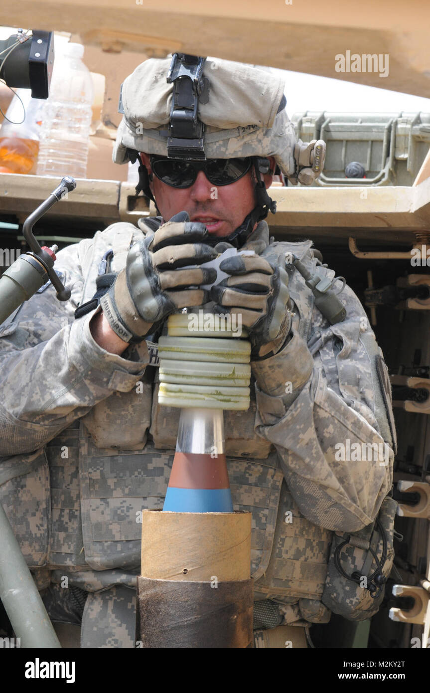 Prepping the mortar round. CONTINGENCY OPERATING SITE MAREZ, Iraq – Spc ...