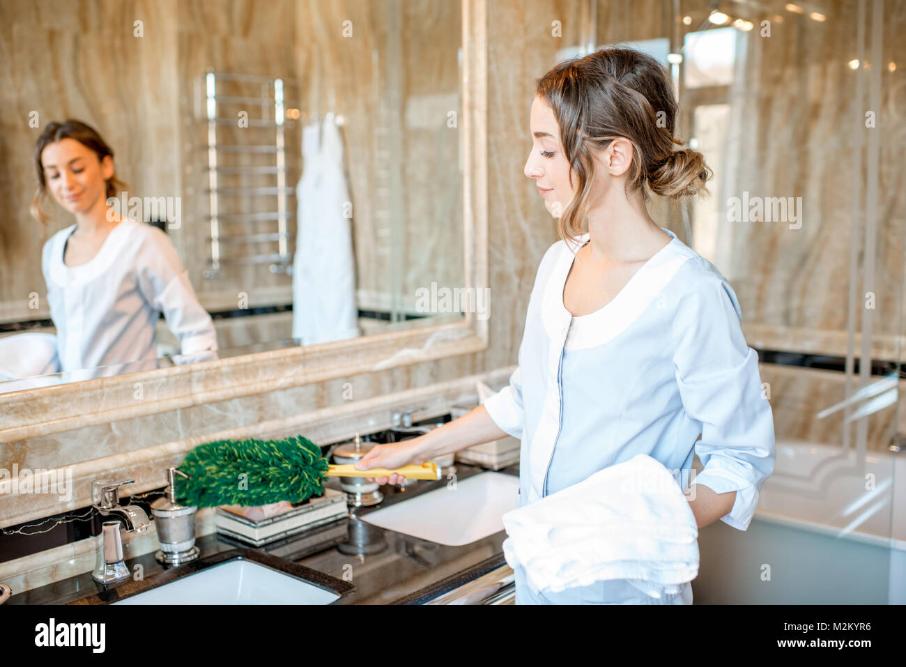 Chambermaid in the hotel bathroom Stock Photo - Alamy