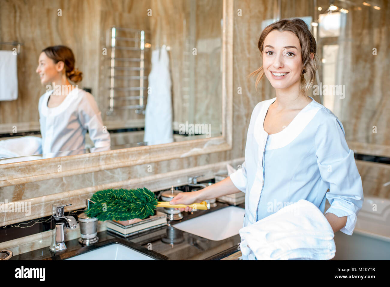 Chambermaid in the hotel bathroom Stock Photo - Alamy