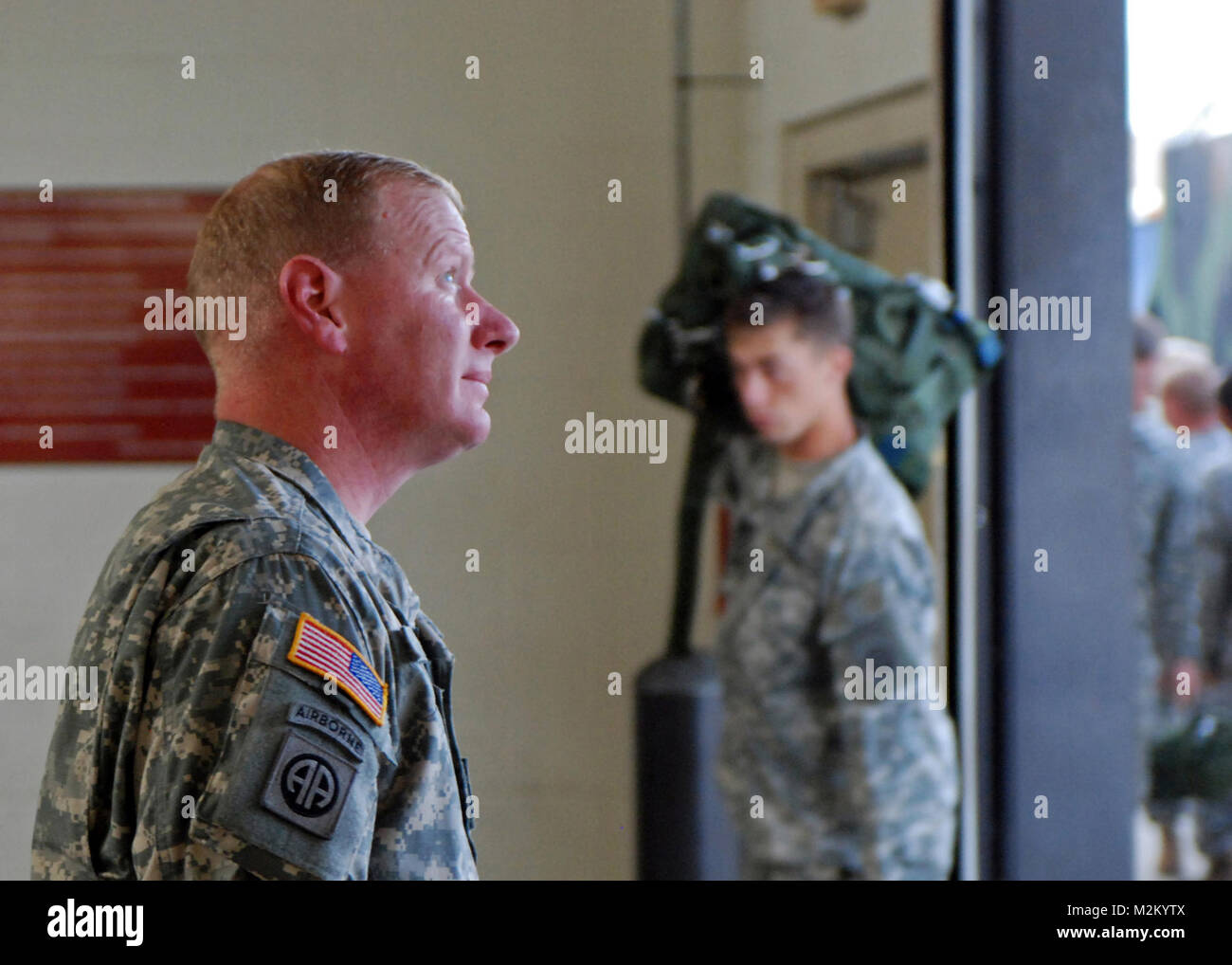 Col.O'neil looks up at the sky before boarding a C-17 aircraft which ...