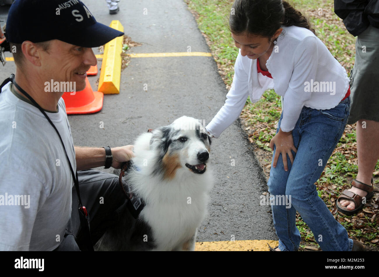 Search and Rescue dog Kobe enjoys pets from Rose J Curtis at the ...