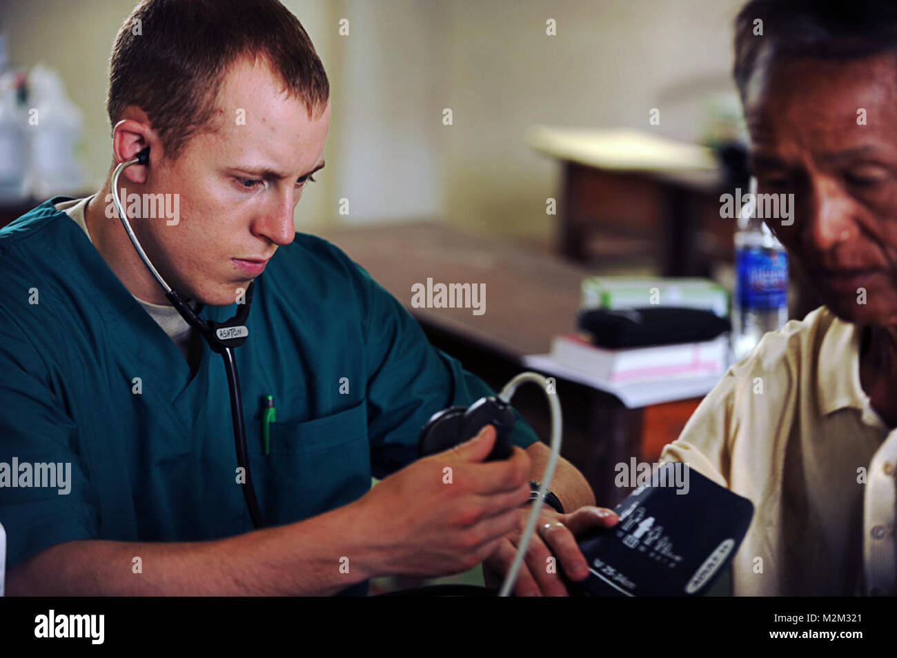 Staff Sgt. Ashton Alan, medical technician, takes the blood pressure of ...