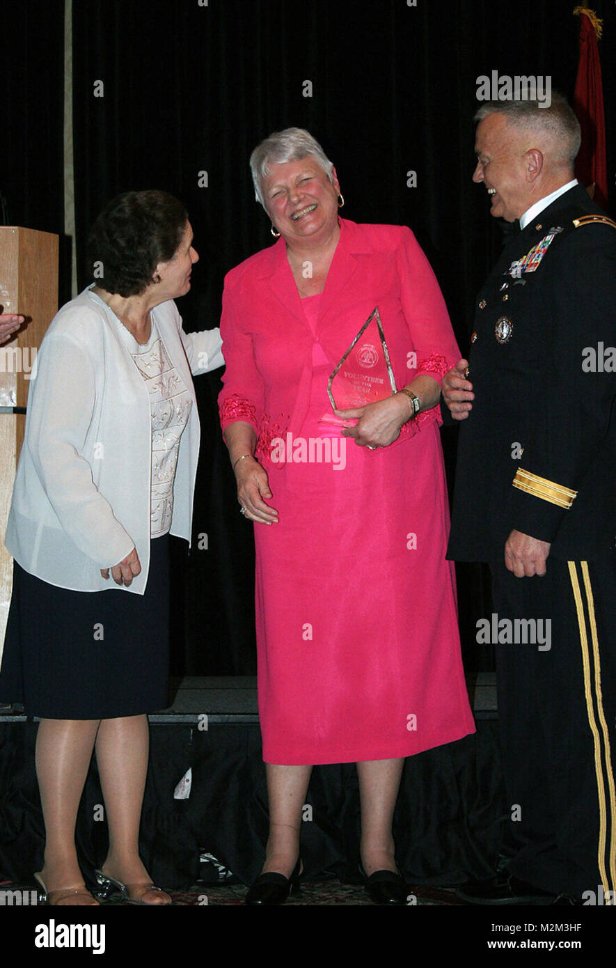 Elaine Harvey, the Volunteer of the Year, shares a moment with MG Terry ...