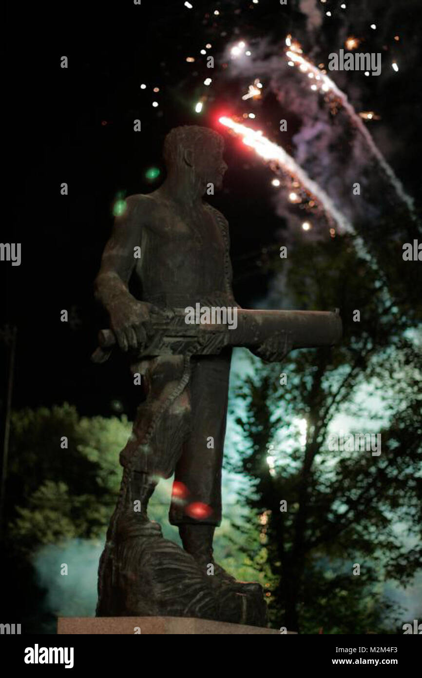 Fireworks erupt over the John Basilone Statue in Raritan, N.J., Sept ...