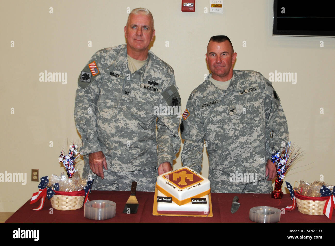Col. Joel Ward and Col. Van Kinchen pose with a cake following the 45th ...