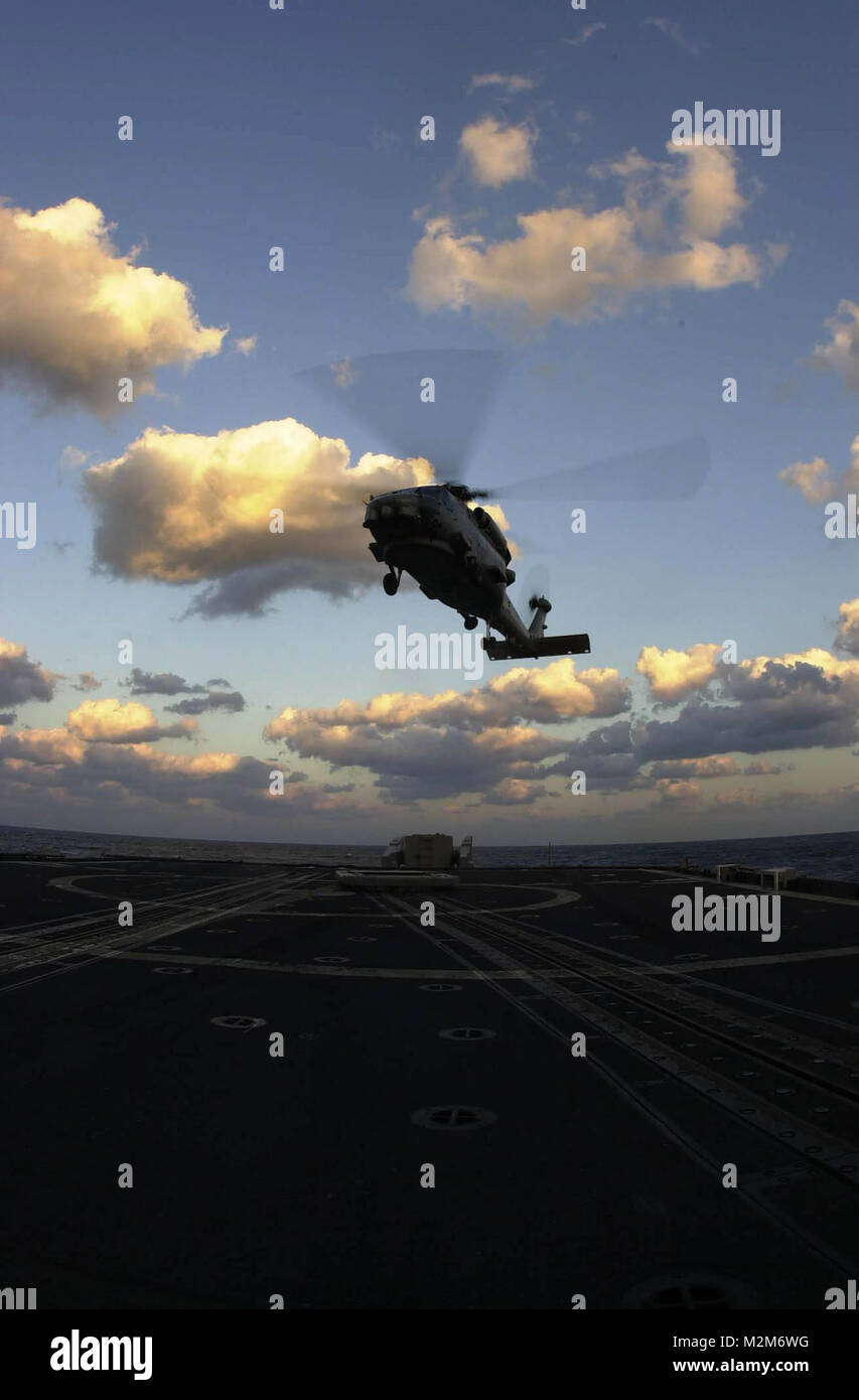 A SH-60 Seahawk of HSL-51, Detachment 6 lands on the flightdeck during ...