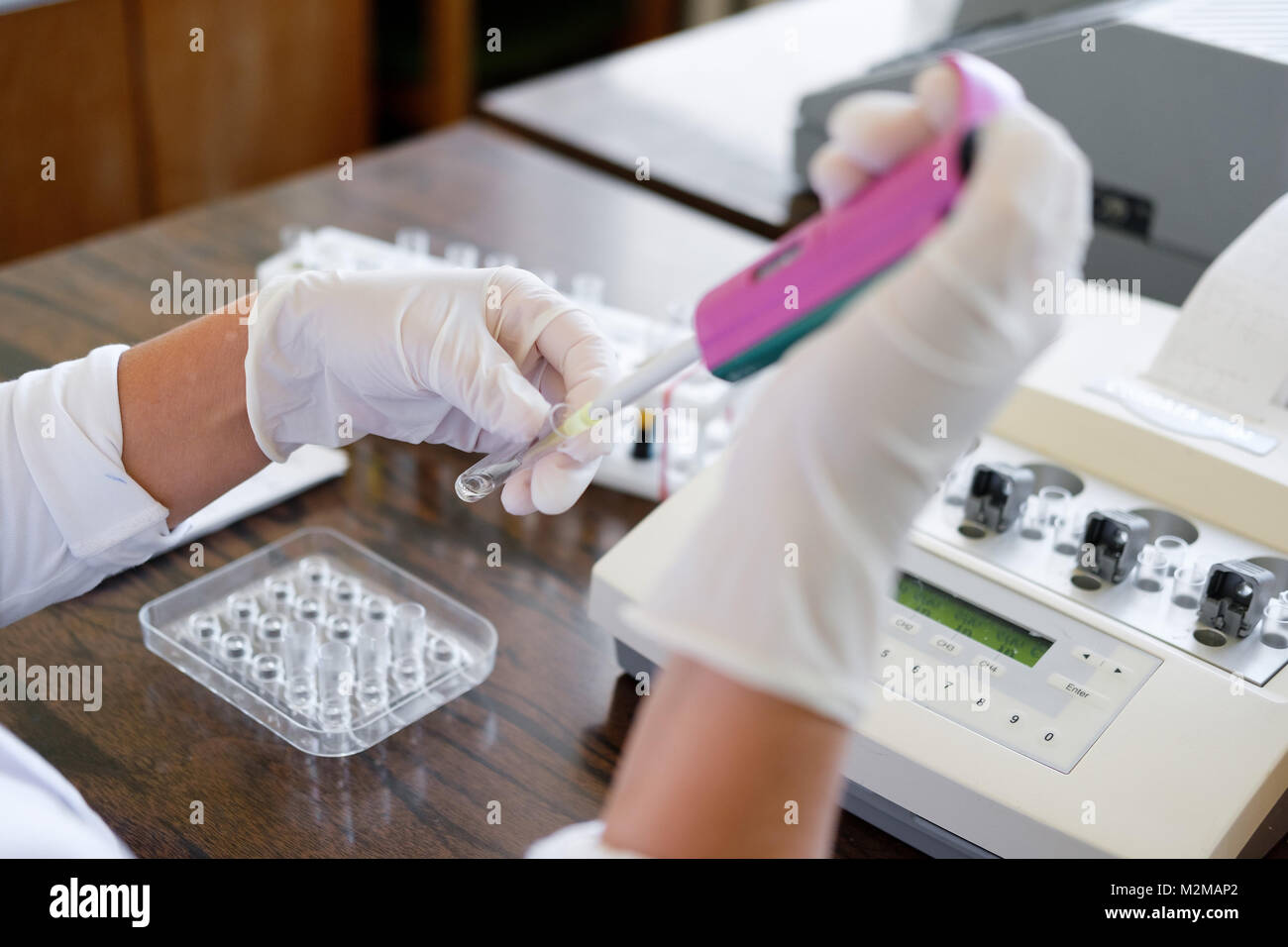 researcher doing research in a lab. Scientist doing chemical test in ...