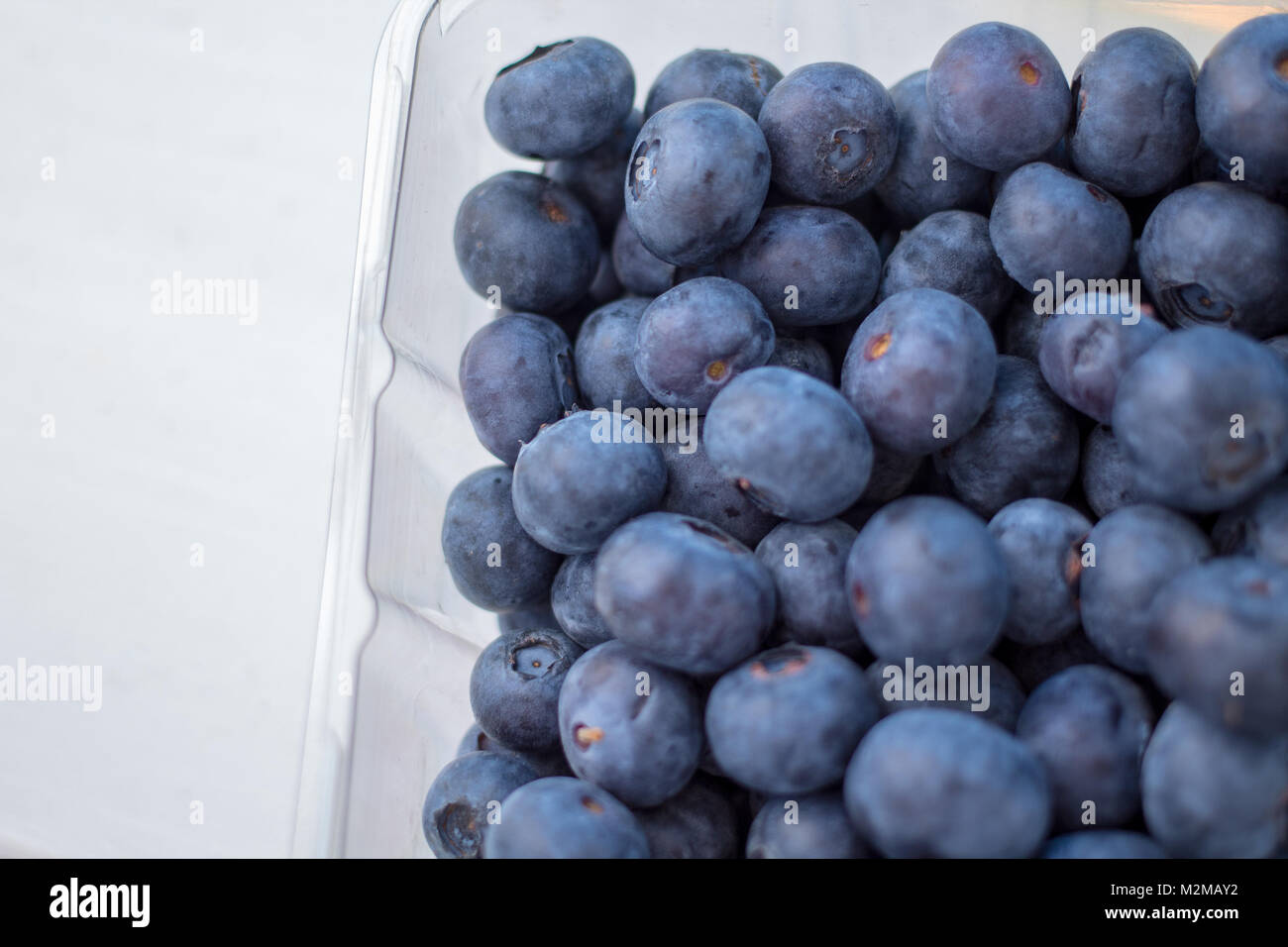 Blueberries in plastic container hi-res stock photography and images ...