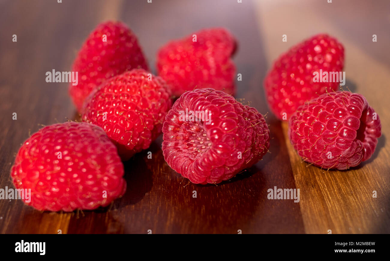 fresh raspberries on cutting board Stock Photo - Alamy