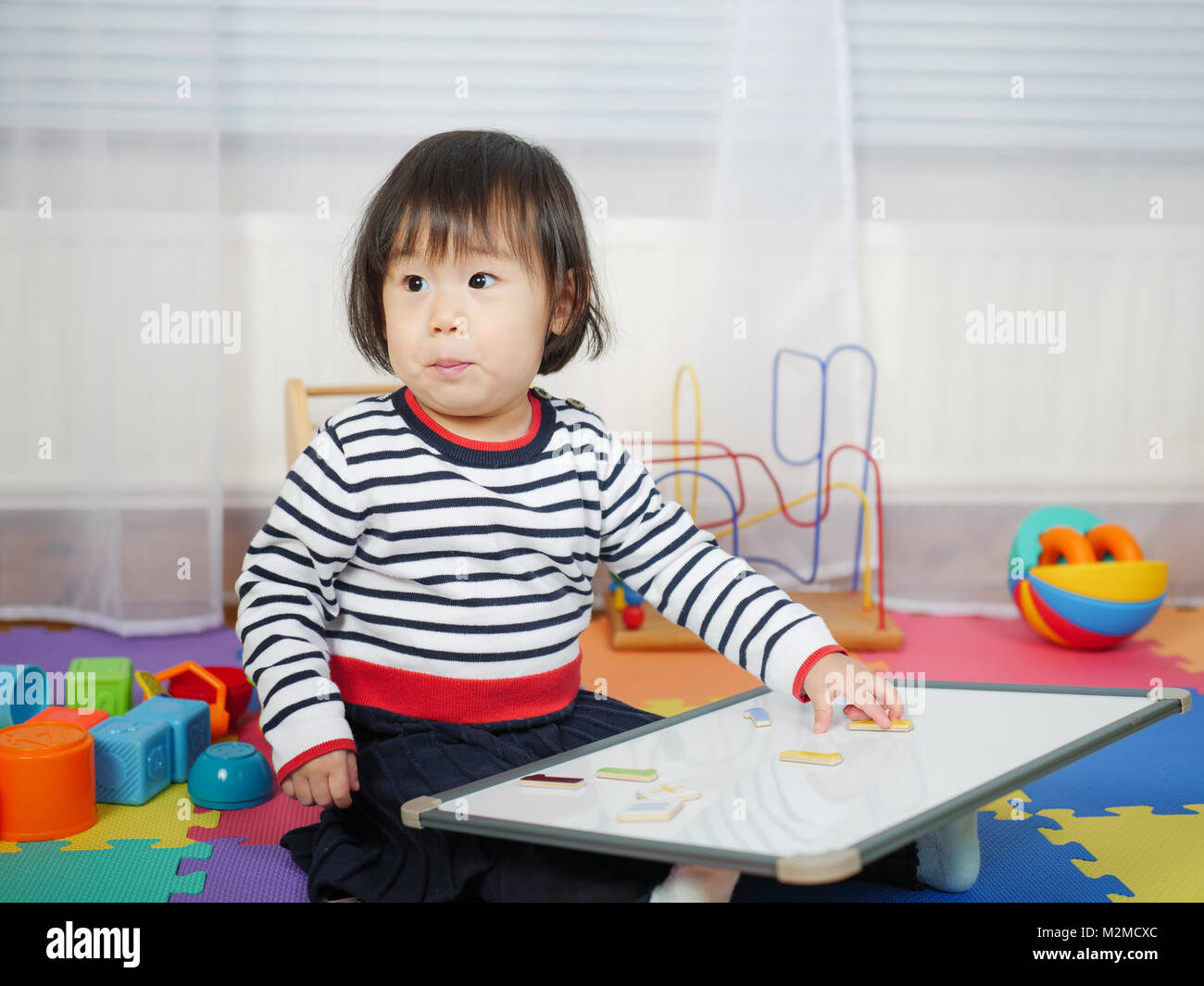 Baby girl learning math at home Stock Photo - Alamy