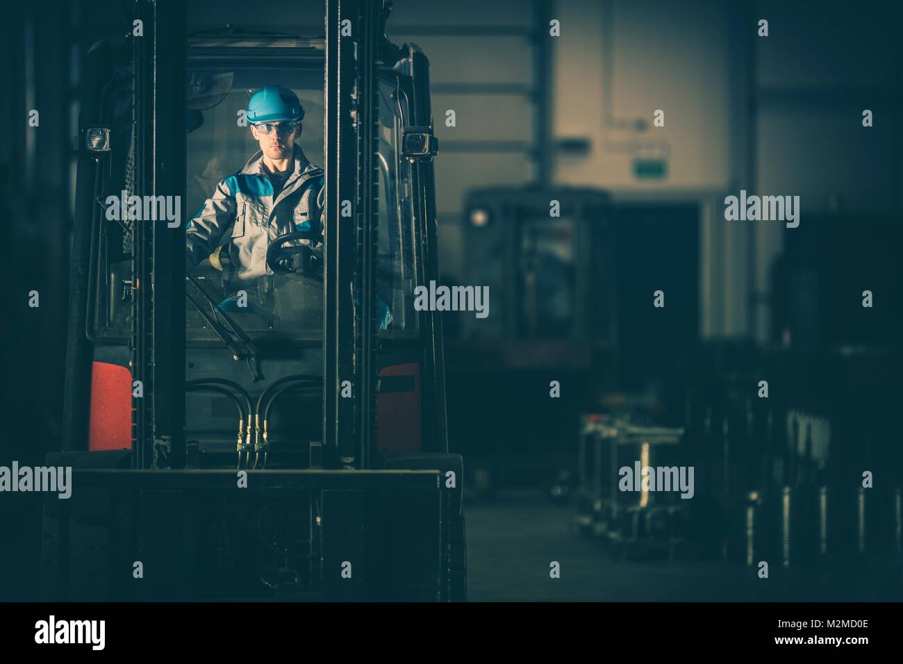 Warehouse Forklift Operator. Caucasian Worker Moving Elements on the ...