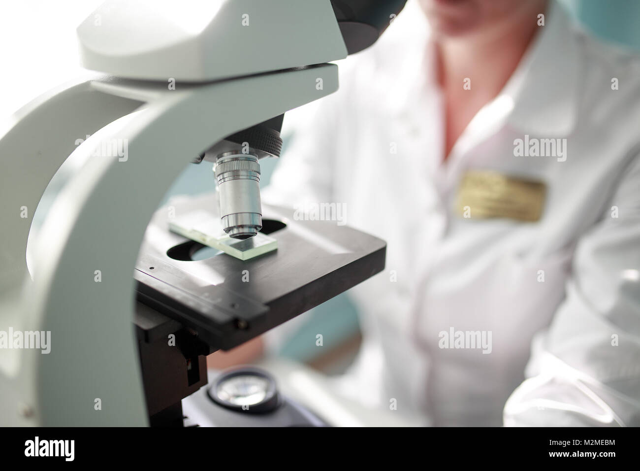 close up of scientist with microscope, examining samples Stock Photo ...