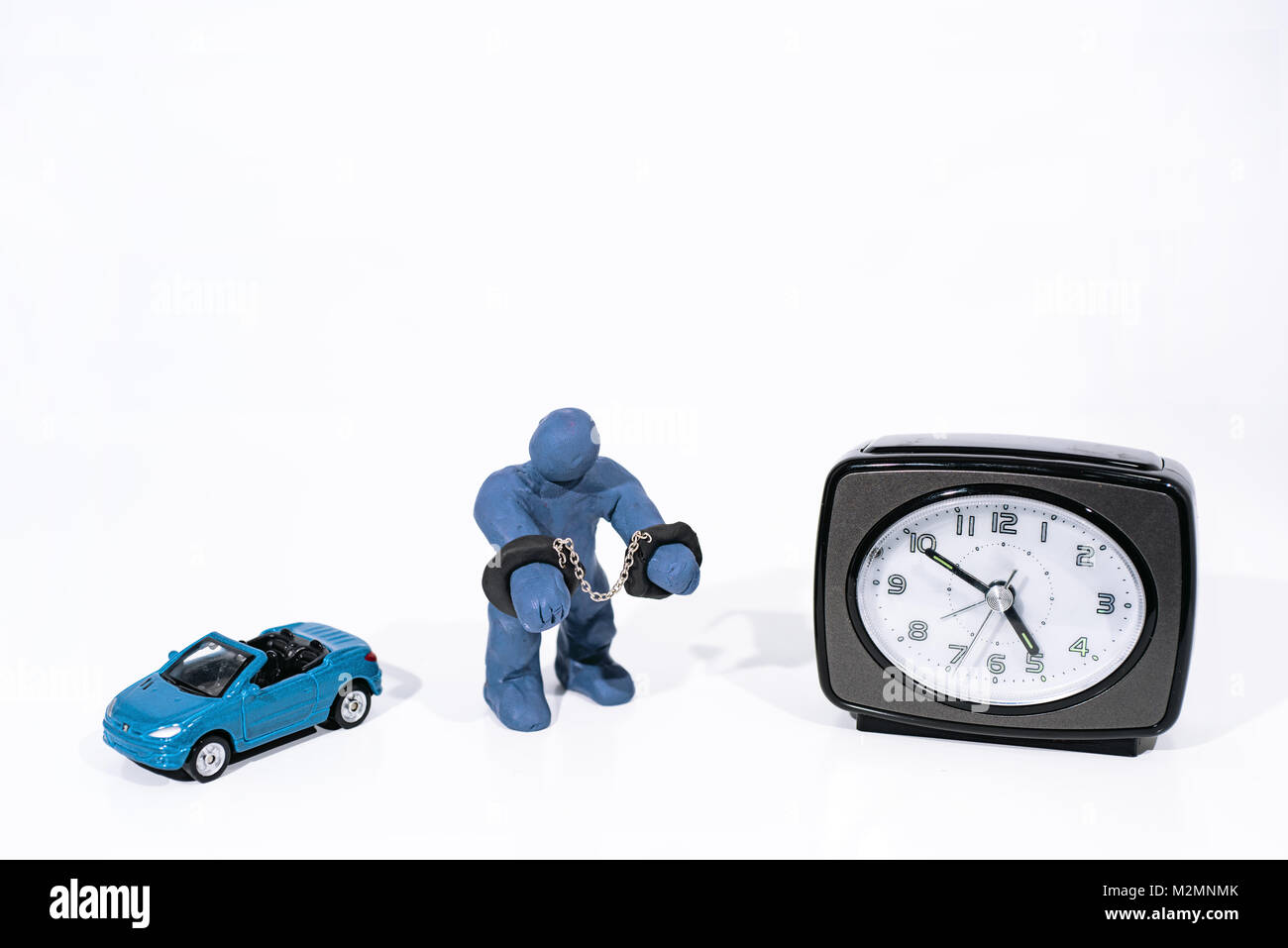 Small blue figure in handcuffs. Made from Play Clay. Isolated on white ...