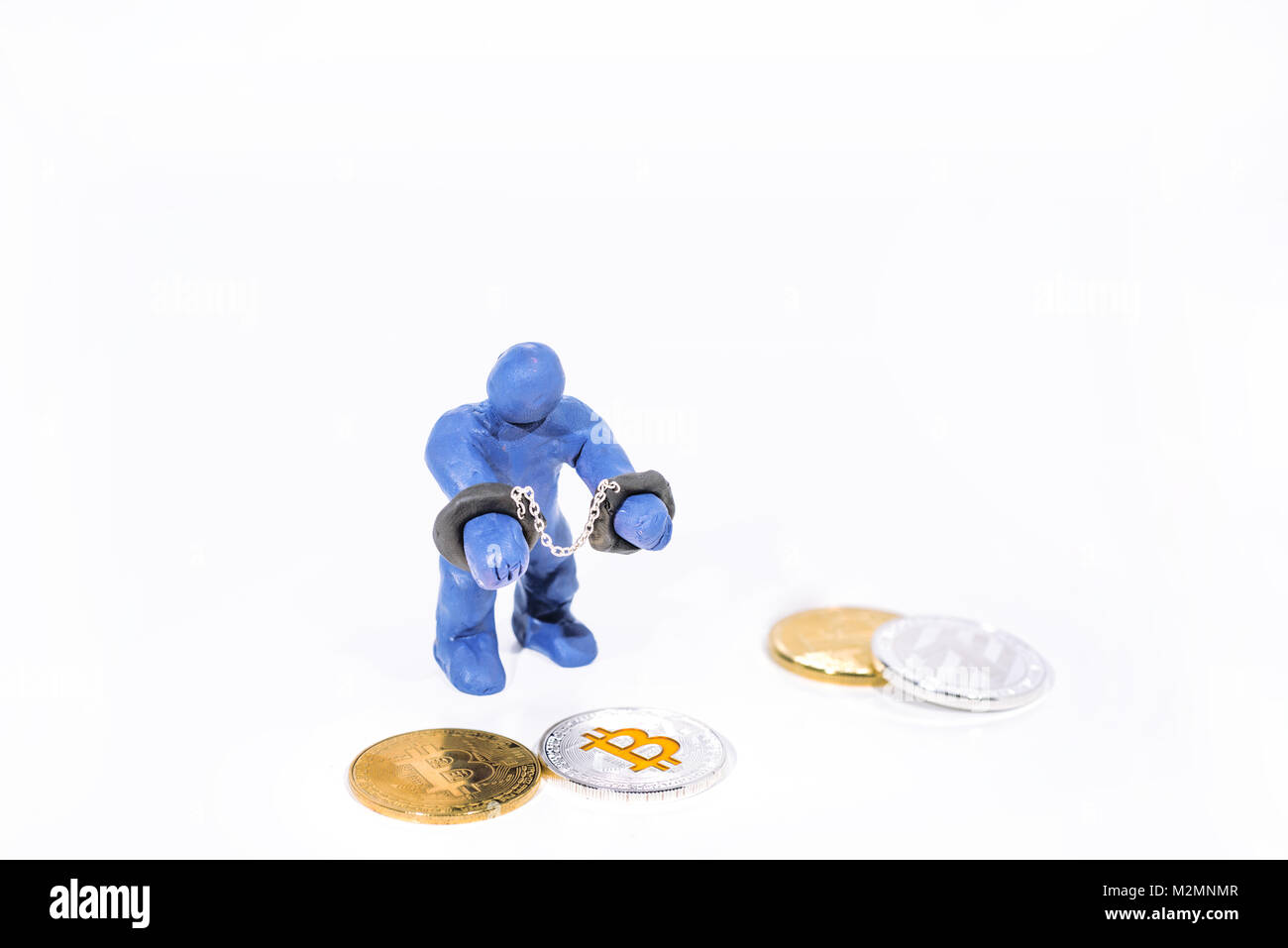 Small blue figure in handcuffs. Made from Play Clay. Isolated on white ...