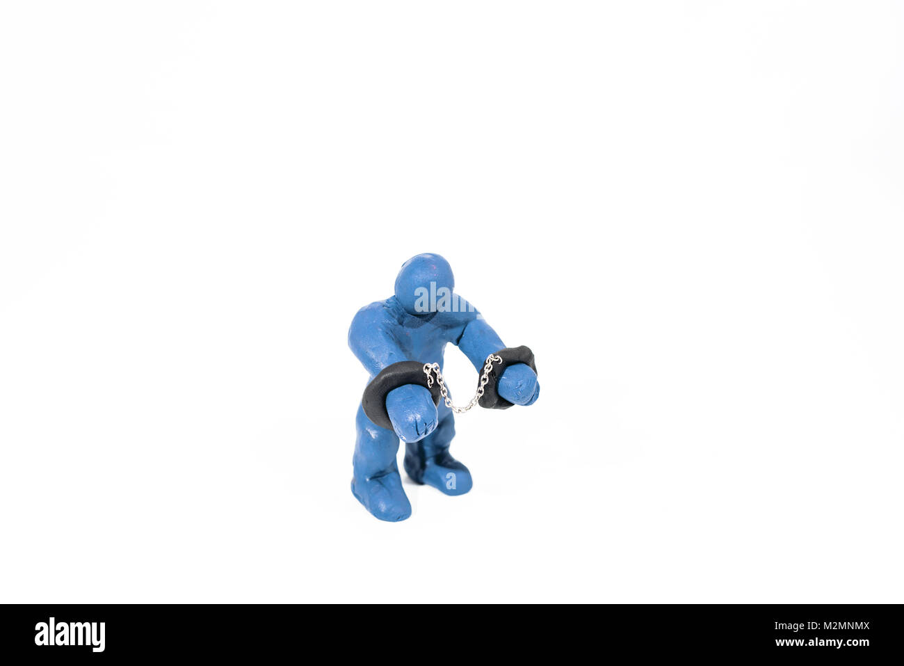 Small blue figure in handcuffs. Made from Play Clay. Isolated on white ...
