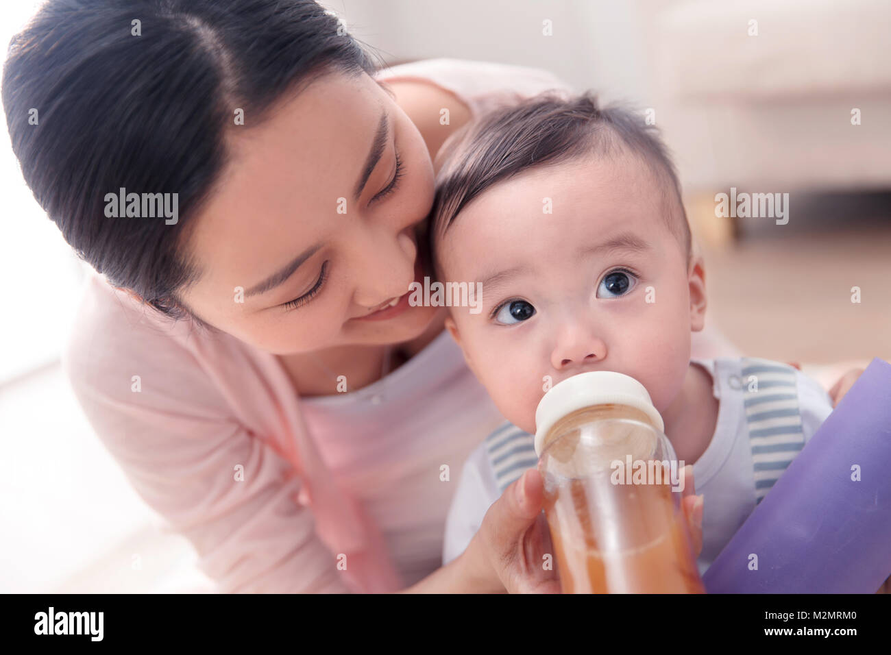Cute baby in milk Stock Photo - Alamy