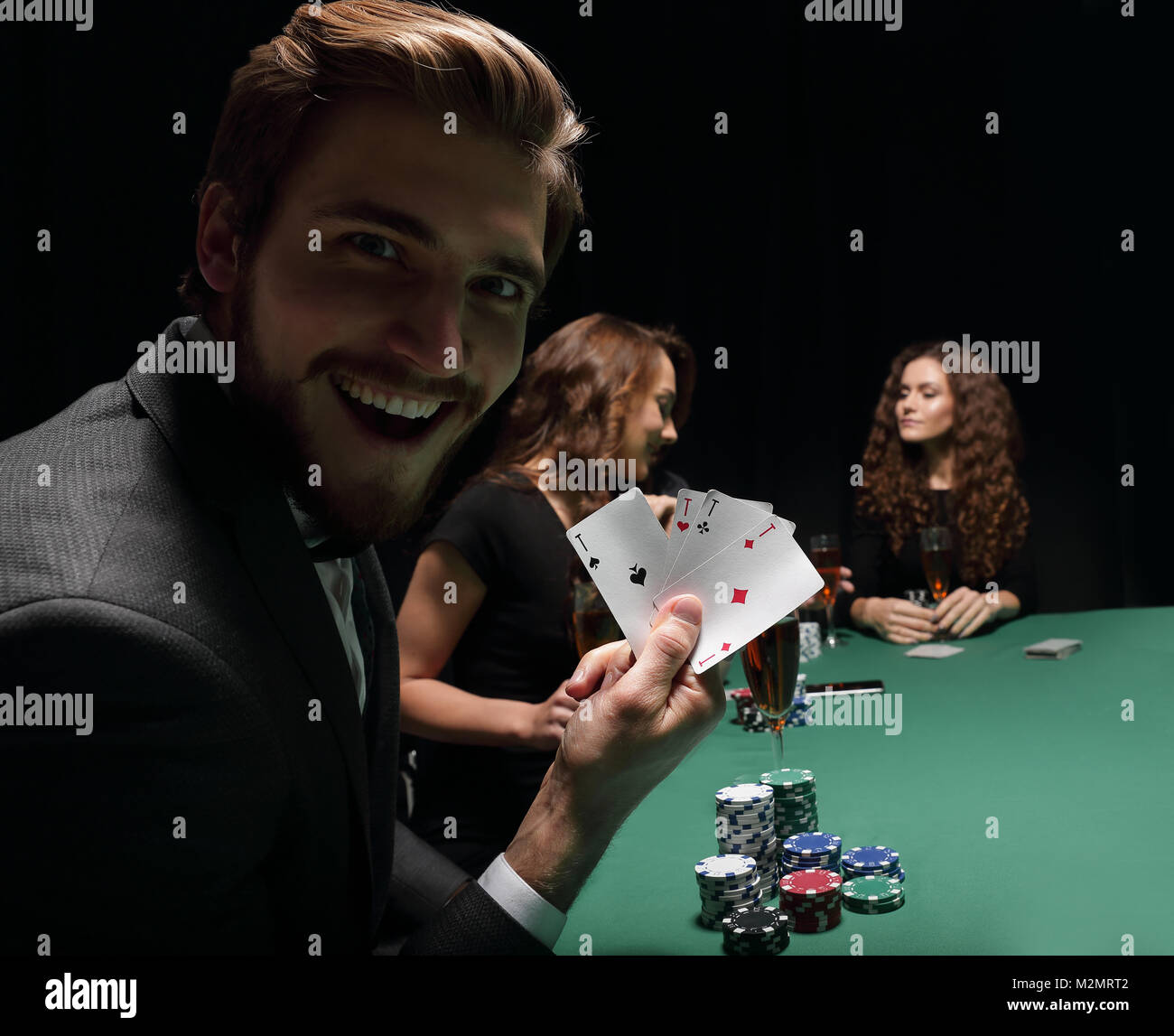 Lucky man with the winning combination of cards Stock Photo - Alamy
