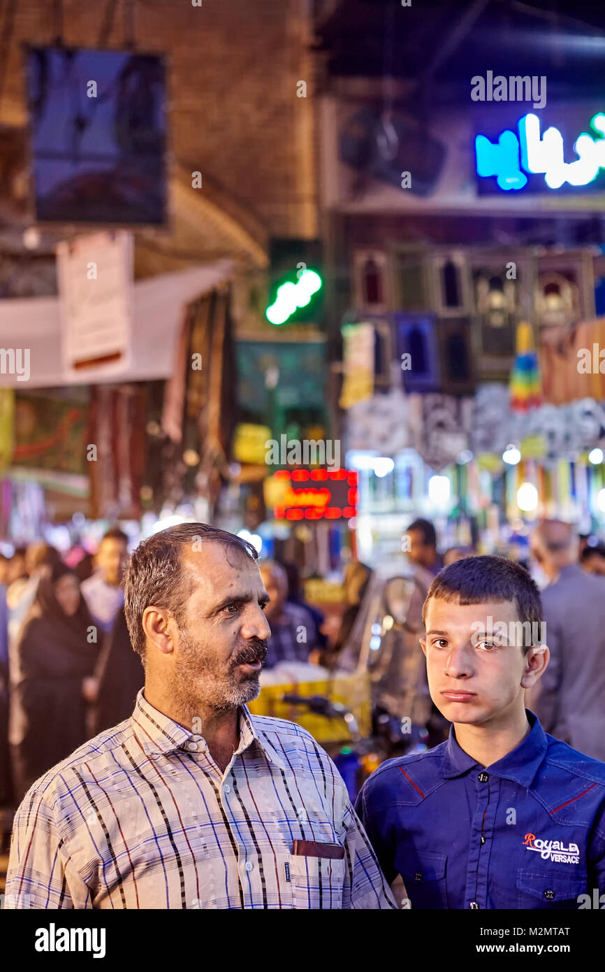 Tehran, Iran - April 27, 2017: A mature Iranian man and boy teenager in ...