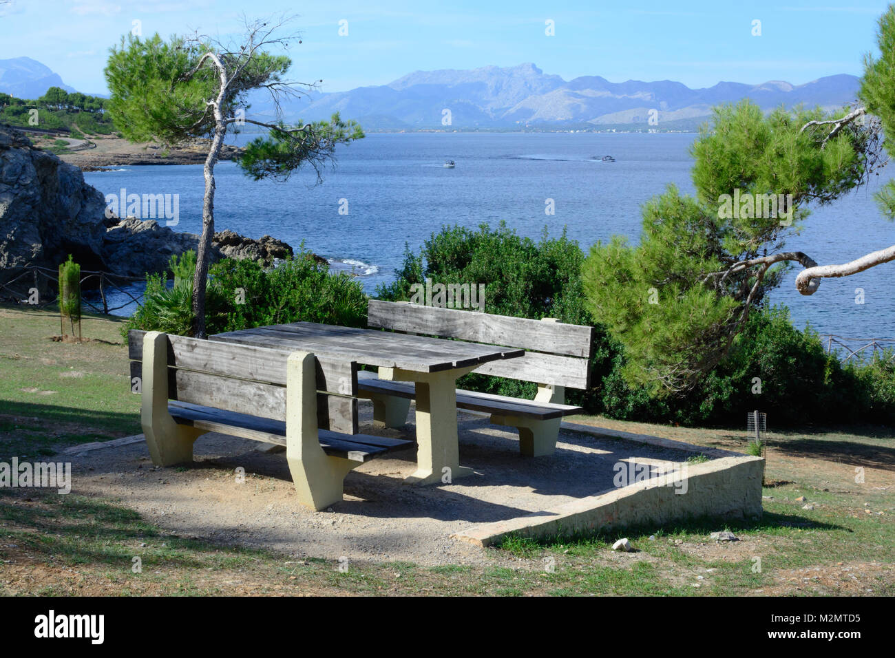 Picnic table and benches by Pollensa bay Stock Photo - Alamy