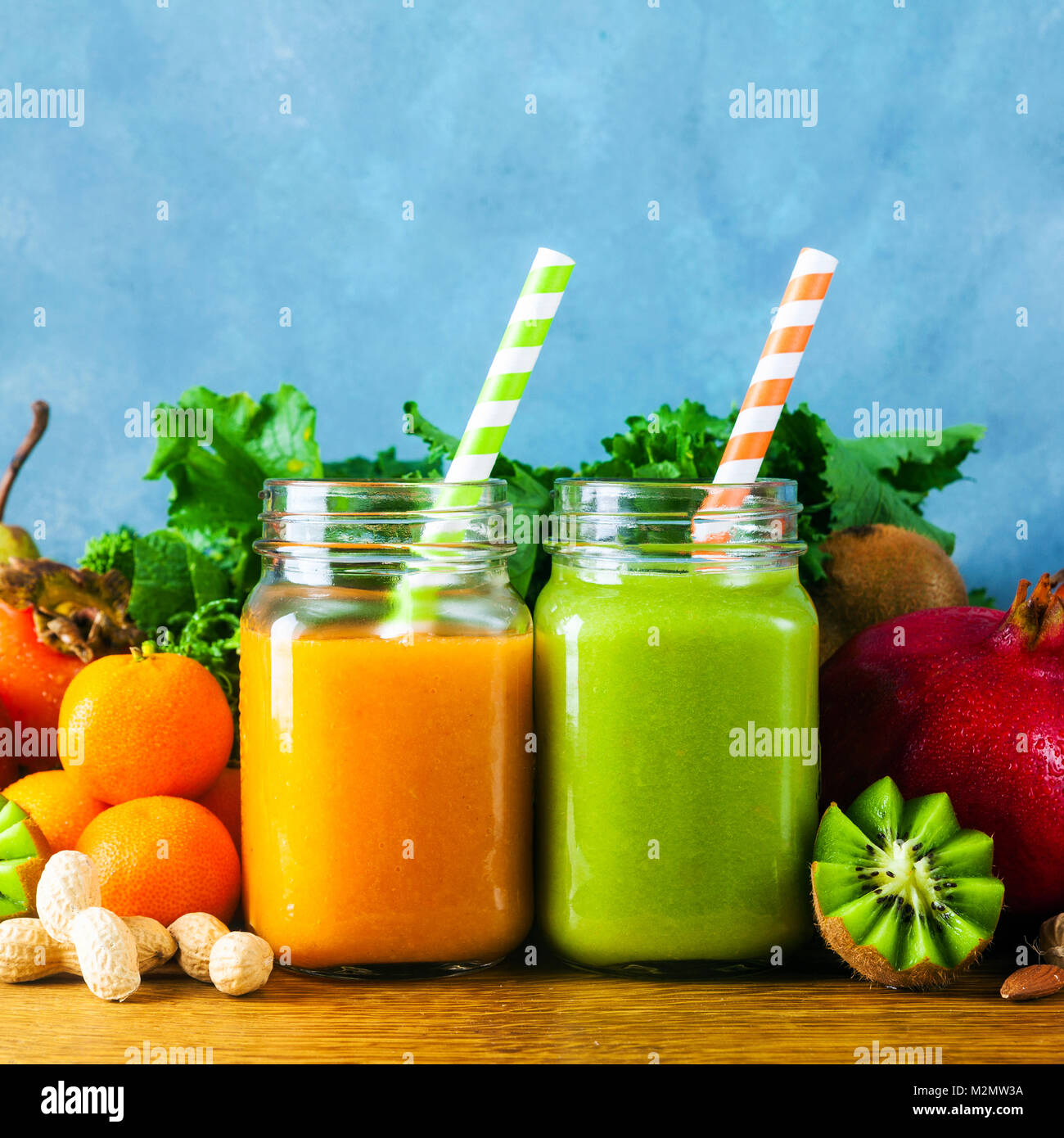 Freshly blended fruit smoothies of various colors and tastes in glass ...
